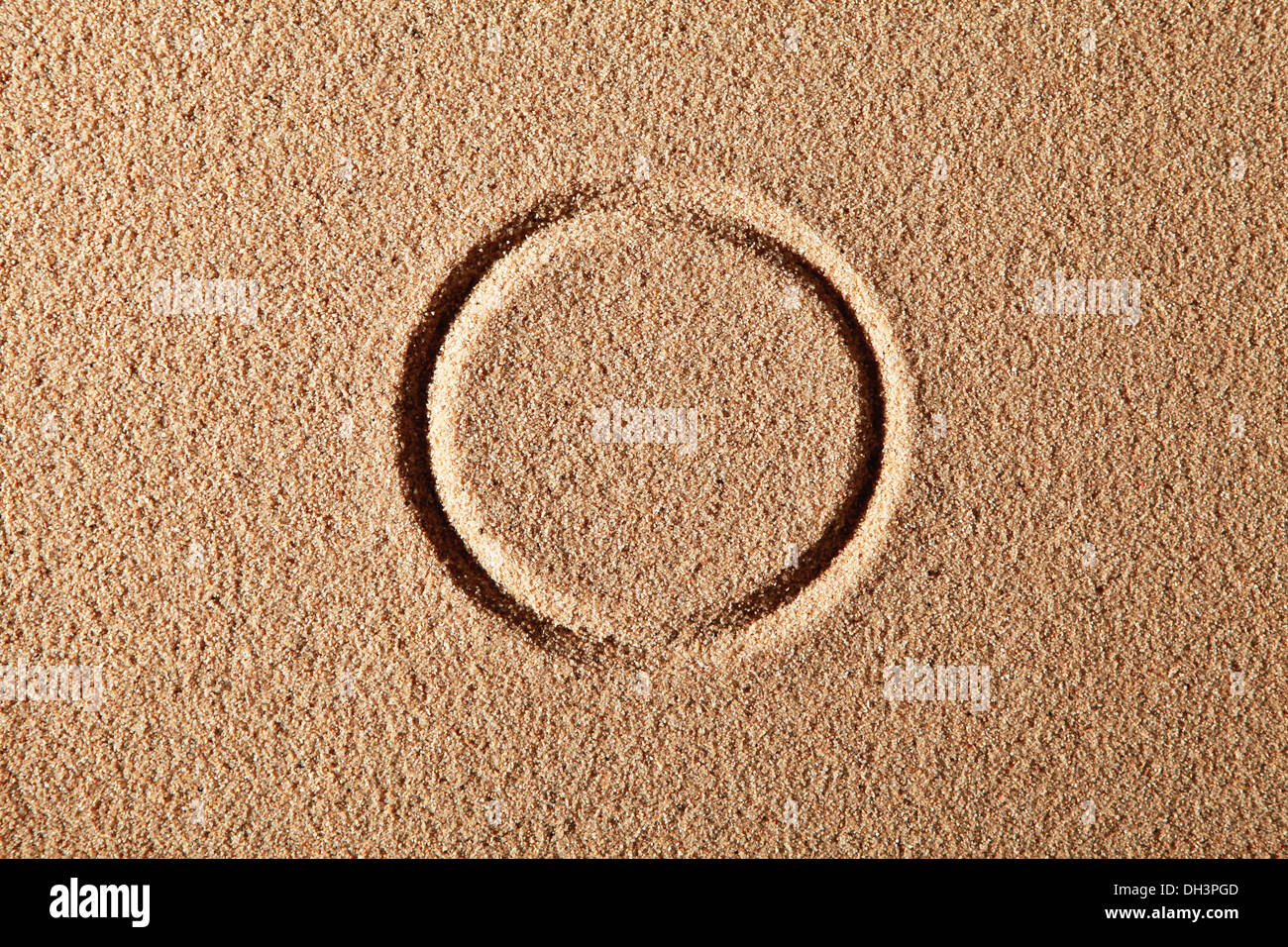 Circle painted in the sand Stock Photo - Alamy