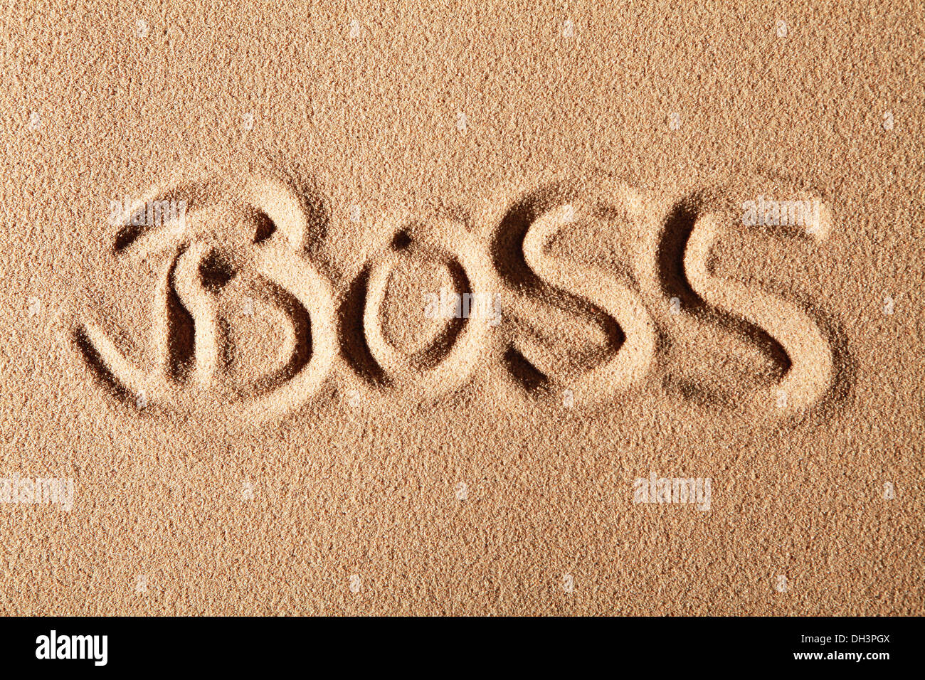 The word BOSS, drawn in sand Stock Photo - Alamy