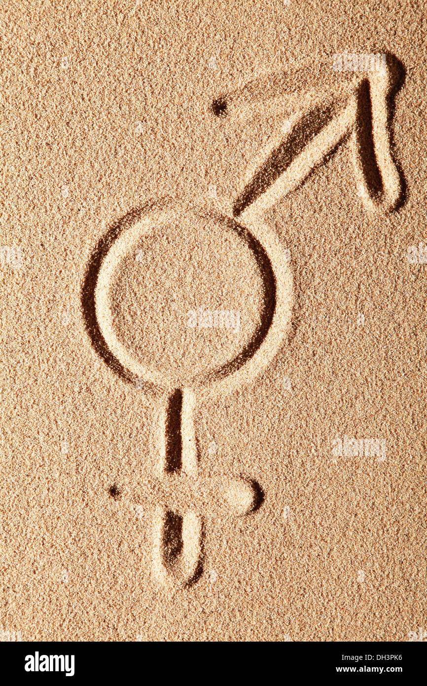 Unisex symbol, drawn in sand Stock Photo - Alamy