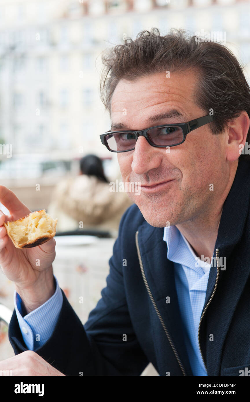 White Caucasian male in his 40s wearing glasses enjoying a traditional ...