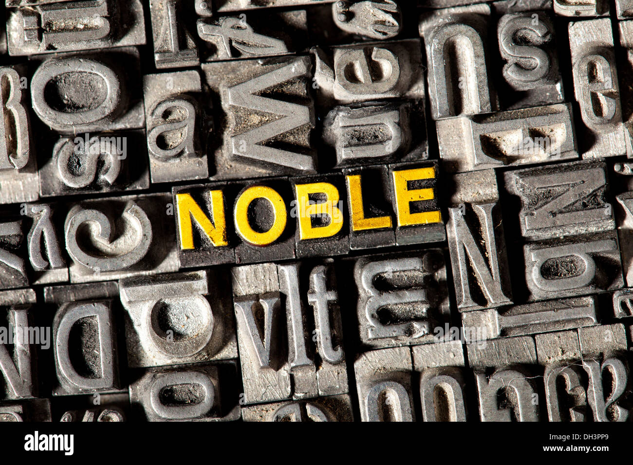 Old lead letters forming the word NOBLE Stock Photo - Alamy