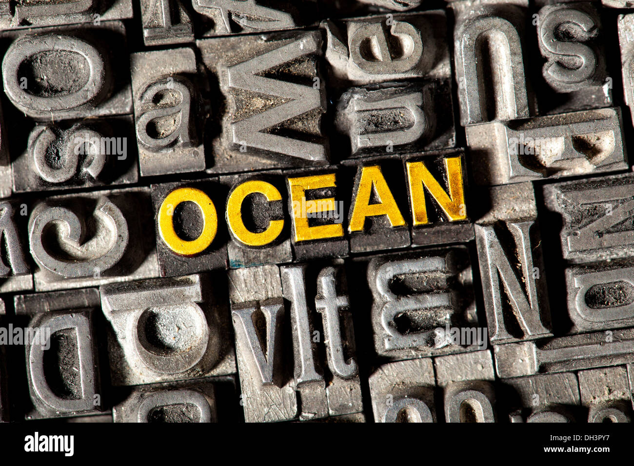 Old lead letters forming the word OCEAN Stock Photo - Alamy
