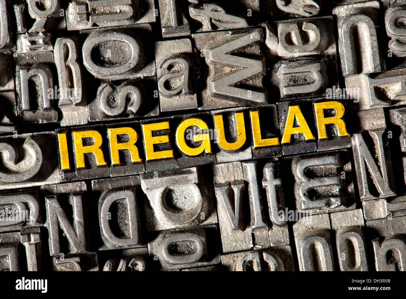 Old lead letters forming the word IRREGULAR Stock Photo - Alamy