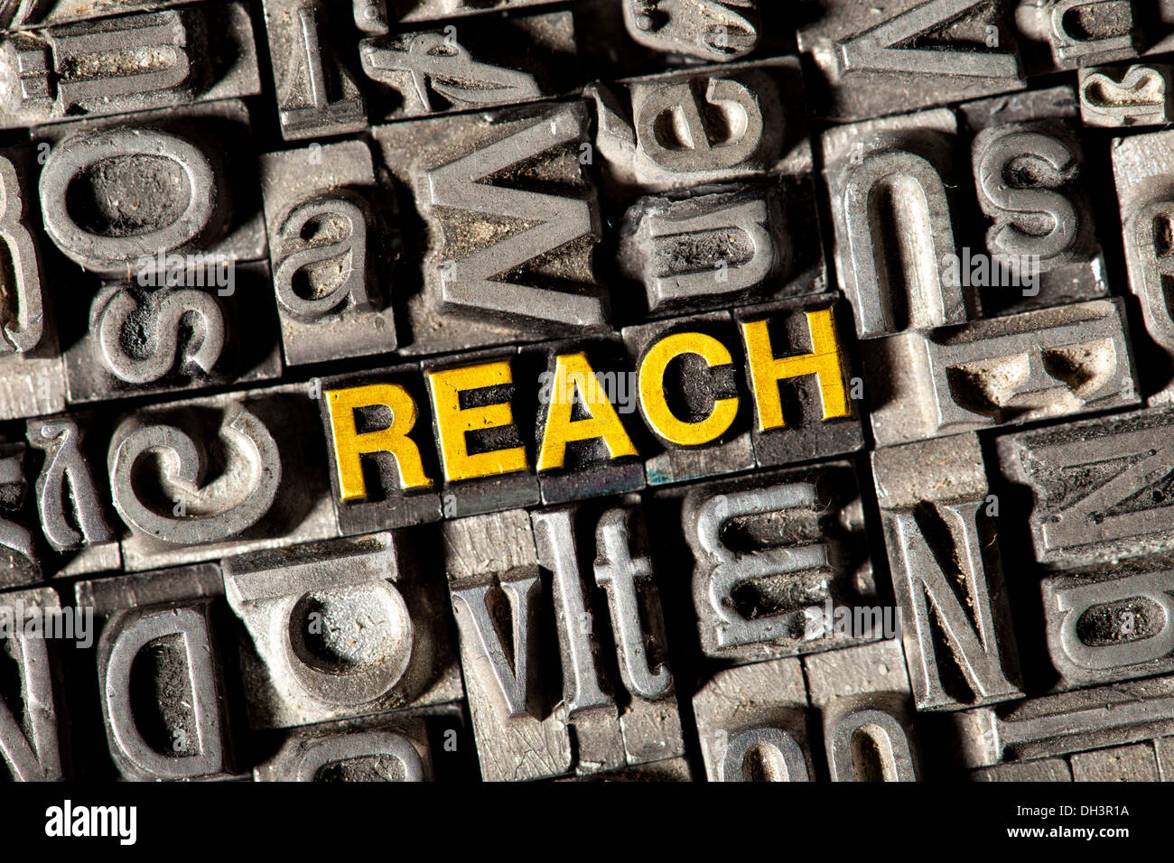 Old lead letters forming the word REACH Stock Photo - Alamy