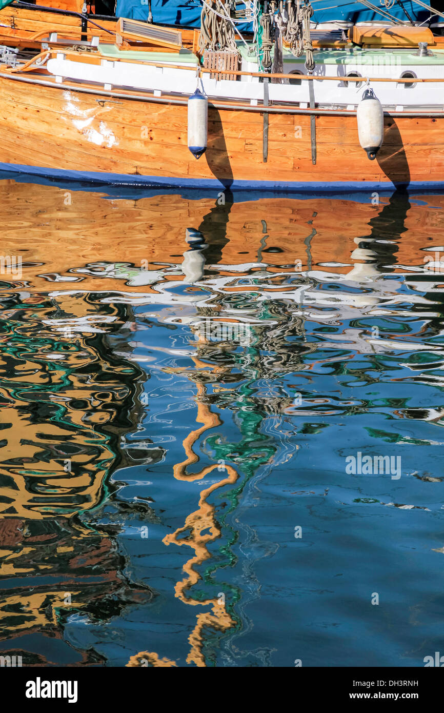 Reflection of an old sailing boat in the water at Nyhavn in Copenhagen ...