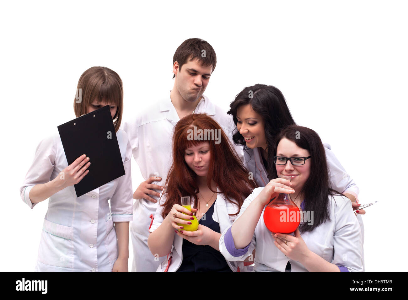 Group of young interns posing in studio Stock Photo - Alamy