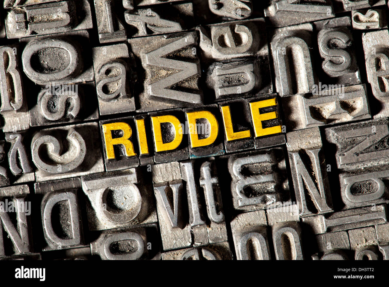 Old lead letters forming the word "RIDDLE Stock Photo - Alamy