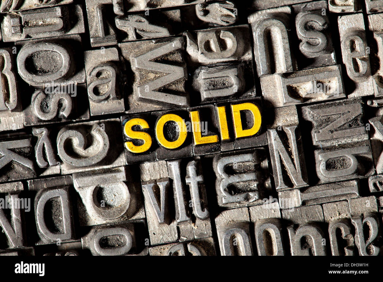 Old lead letters forming the word "SOLID Stock Photo - Alamy