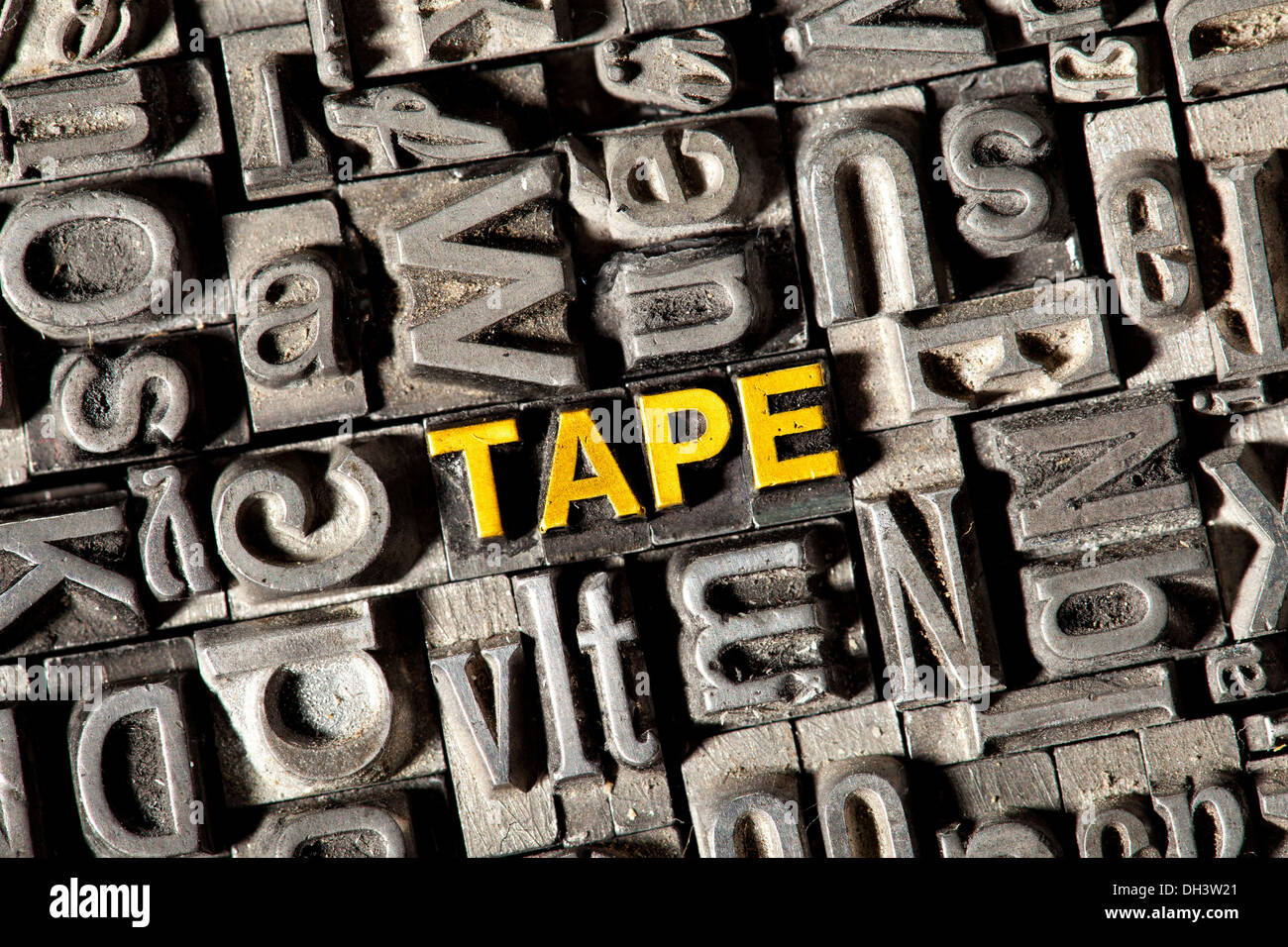 Old lead letters forming the word "TAPE Stock Photo - Alamy