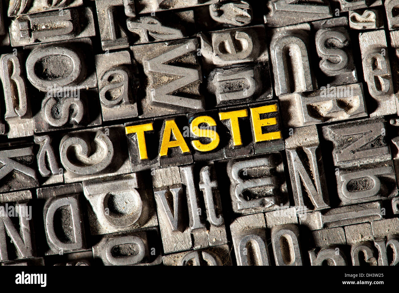 Old lead letters forming the word "TASTE Stock Photo - Alamy
