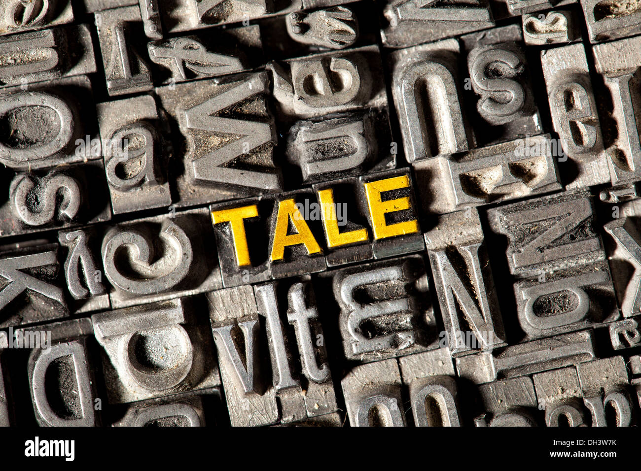 Old lead letters forming the word "TALE Stock Photo - Alamy