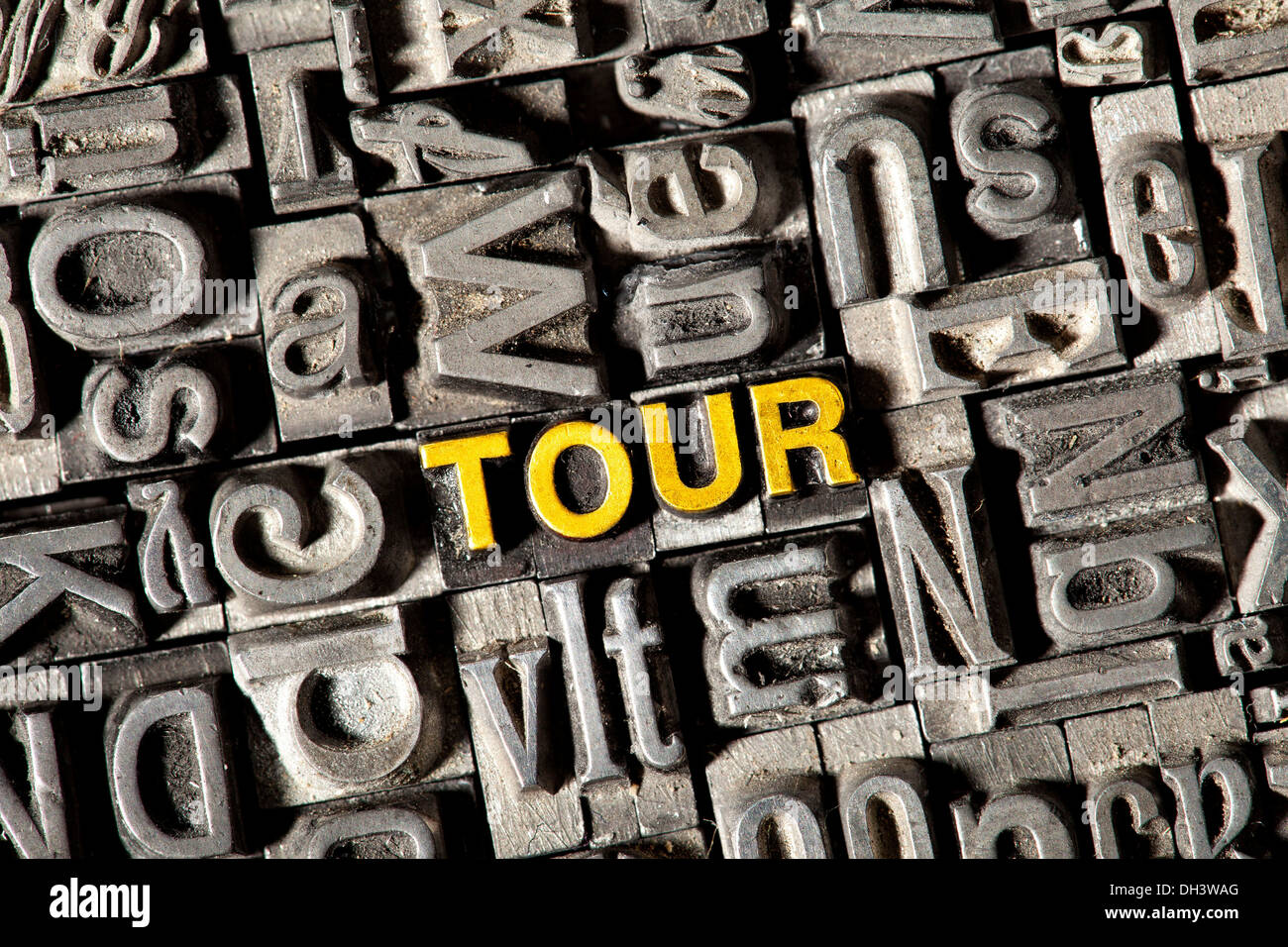 Old lead letters forming the word Tour Stock Photo - Alamy