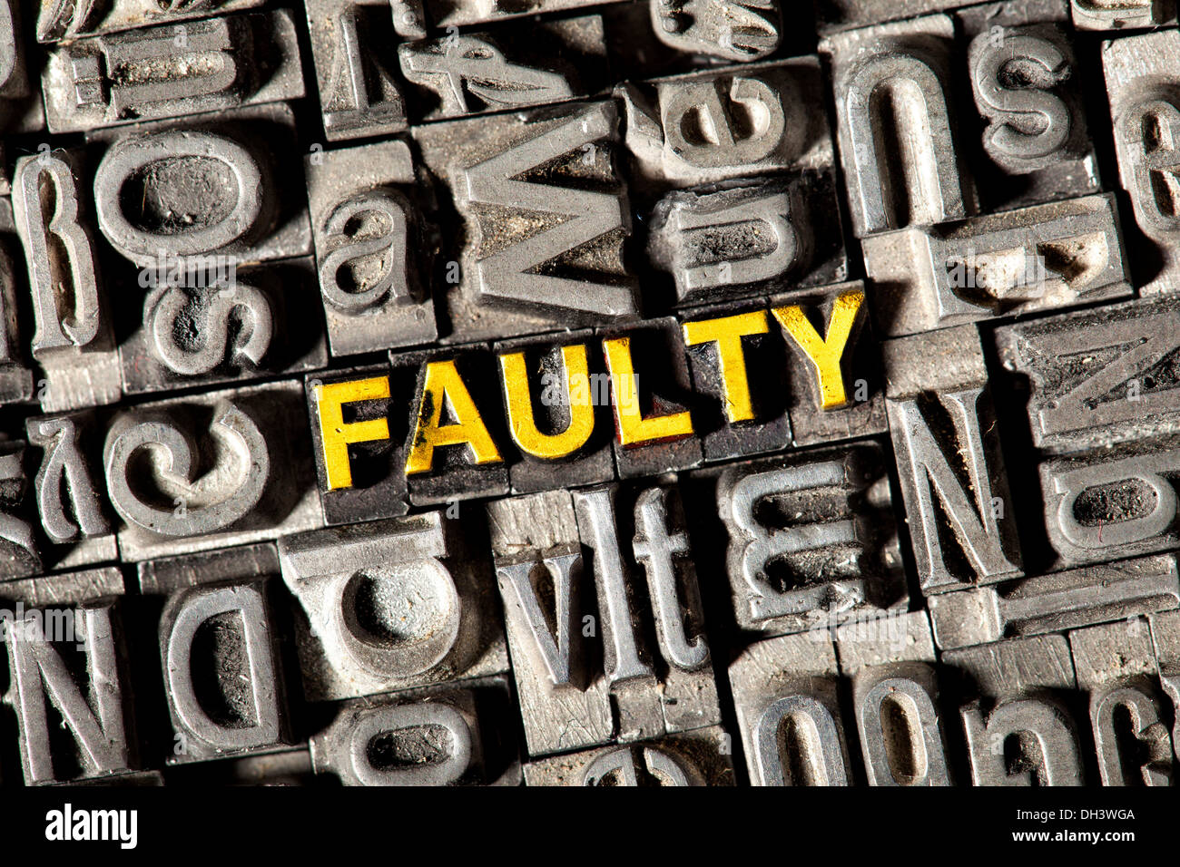 Old lead letters forming the word Faulty Stock Photo - Alamy