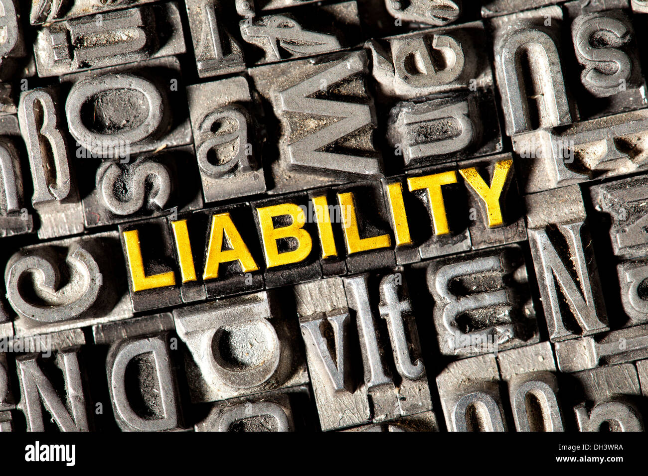 Old lead letters forming the word Liability Stock Photo - Alamy