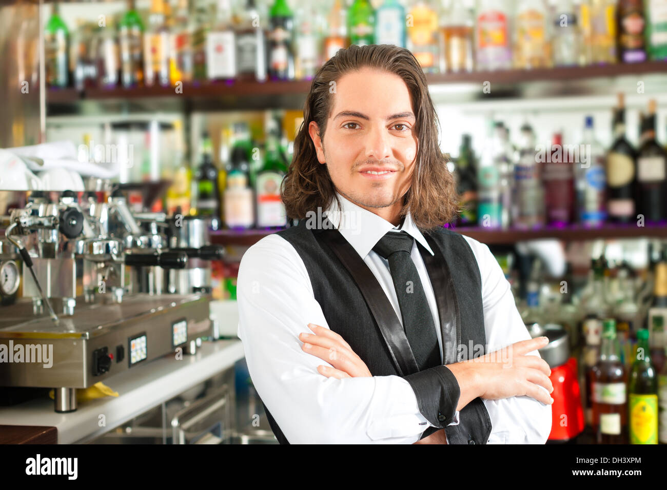 Young Barista or barman standing in his cafe or bar Stock Photo - Alamy