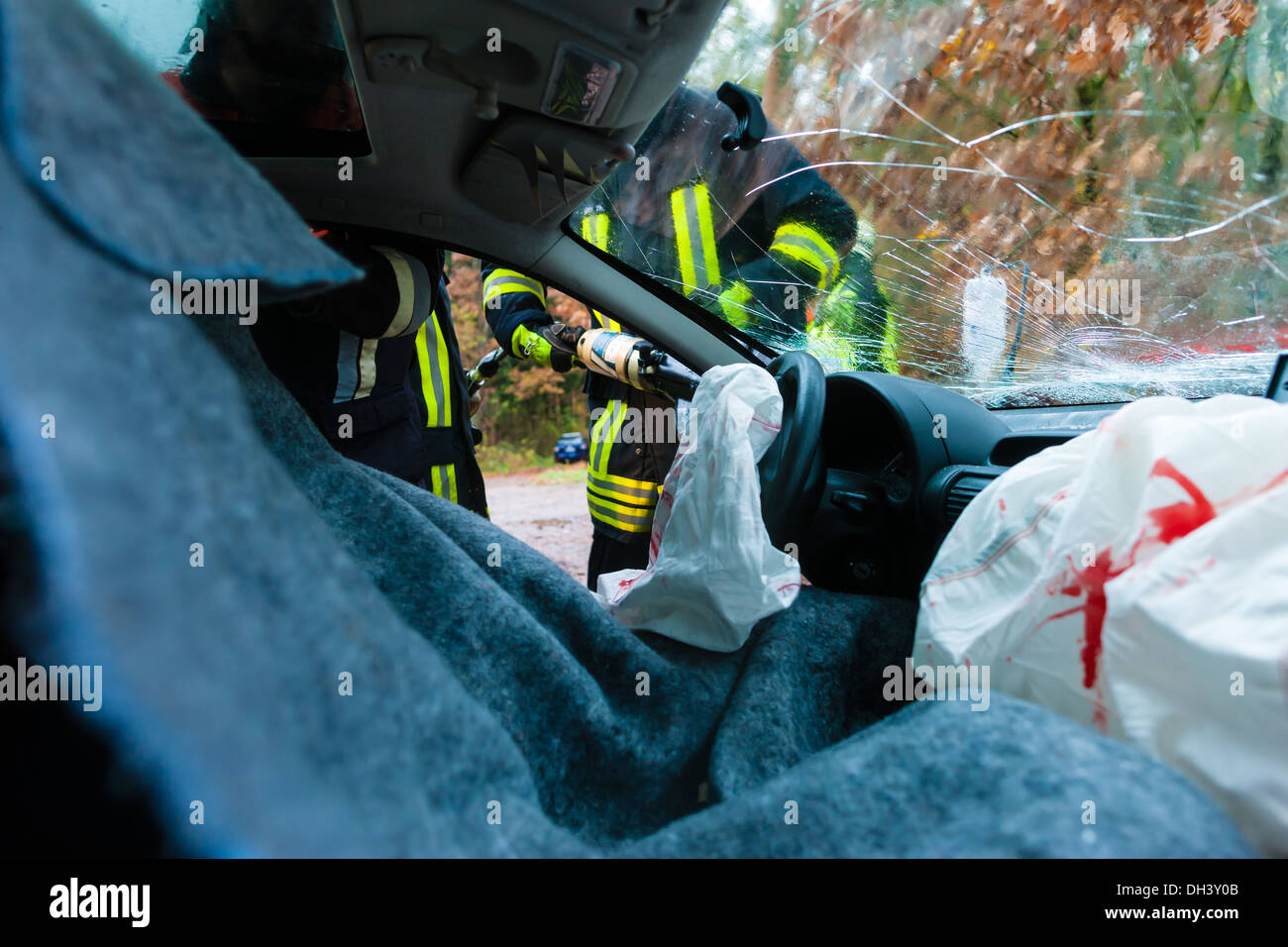 Accident - victim in a crashed vehicle, she receives medical first aid ...
