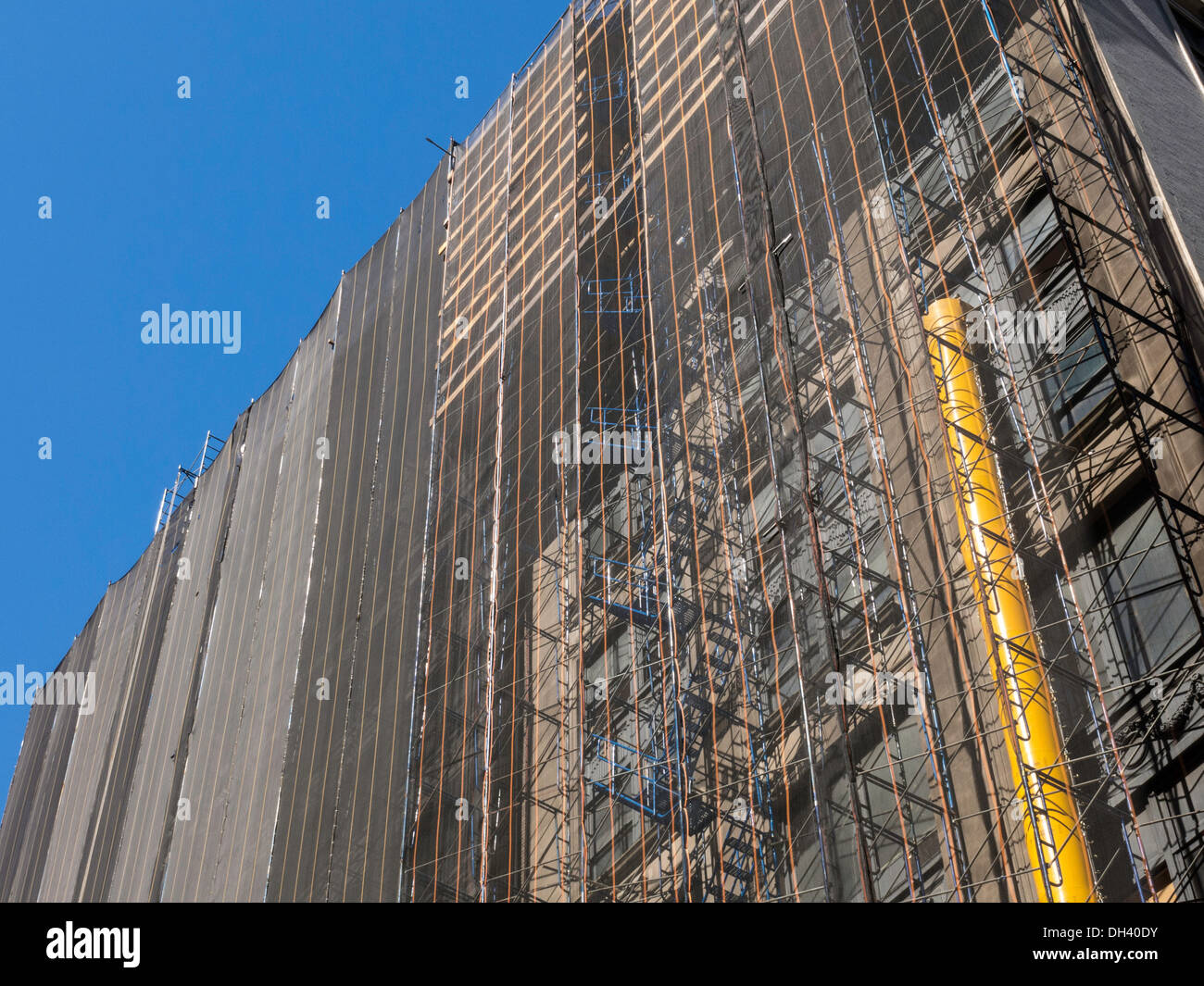 Demolition Chute at Building Construction Site in NYC Stock Photo - Alamy
