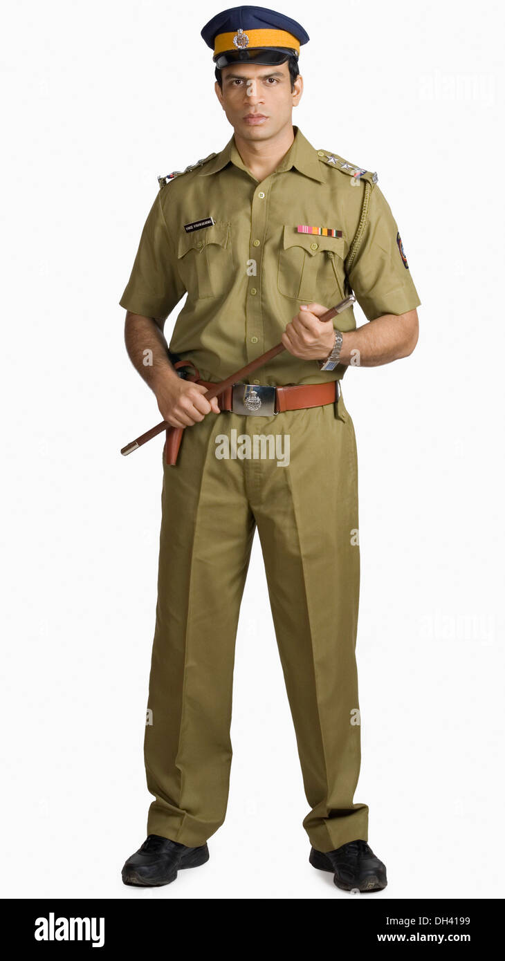 Portrait of a policeman holding a nightstick Stock Photo - Alamy