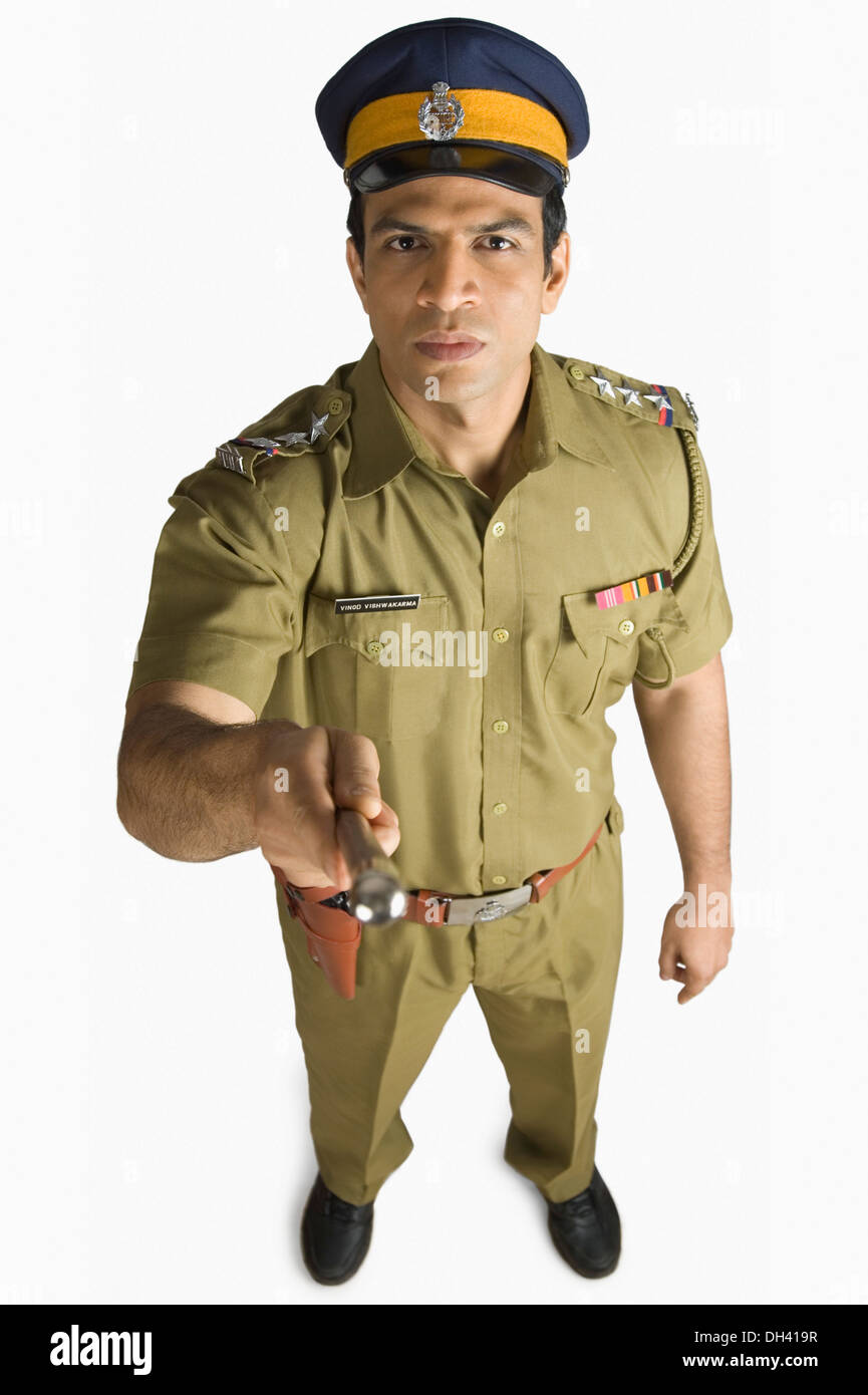 Portrait of a policeman pointing forward with a nightstick Stock Photo ...