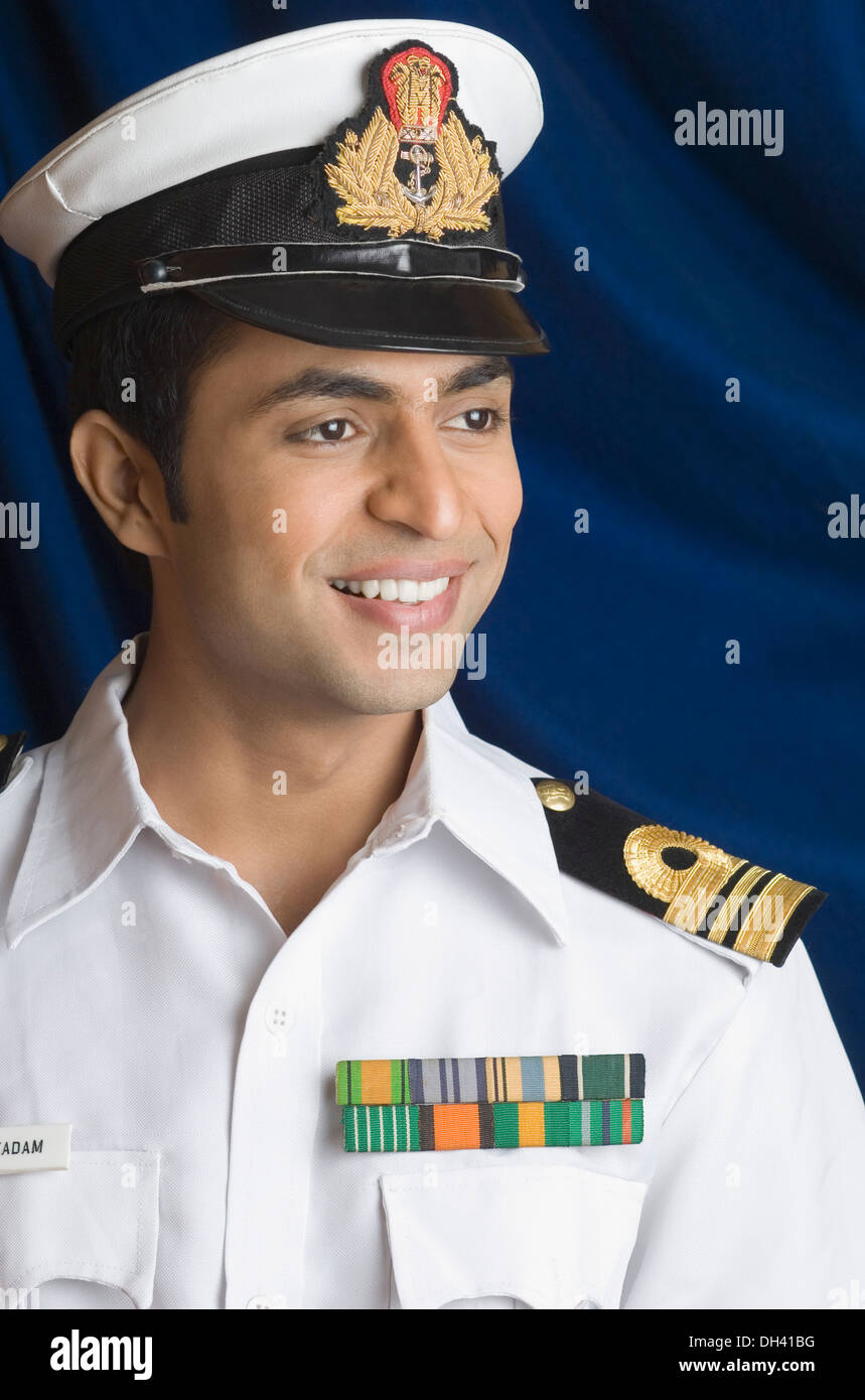 Looking away uniform authority smiling hi-res stock photography and ...