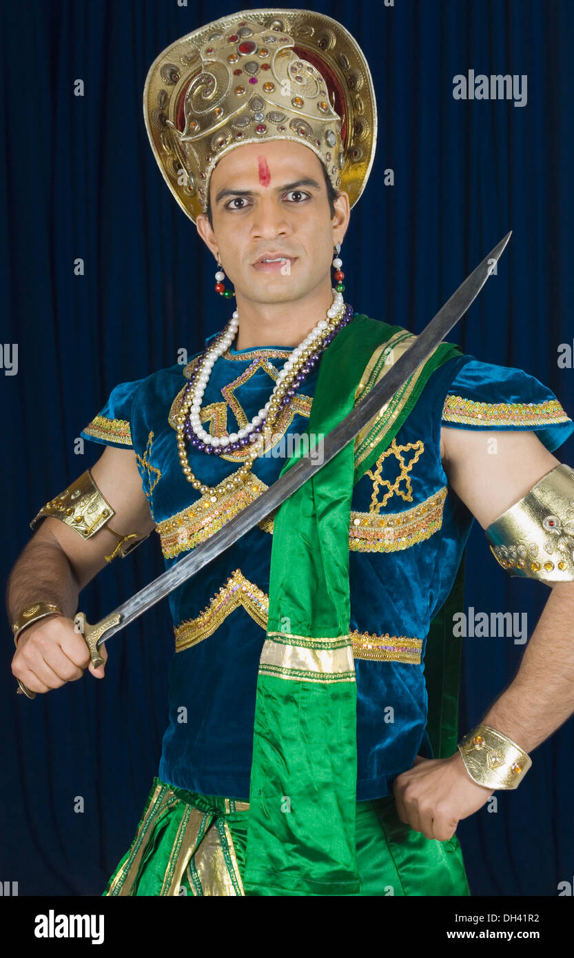 Male character of a Hindu epic holding a sword Stock Photo - Alamy