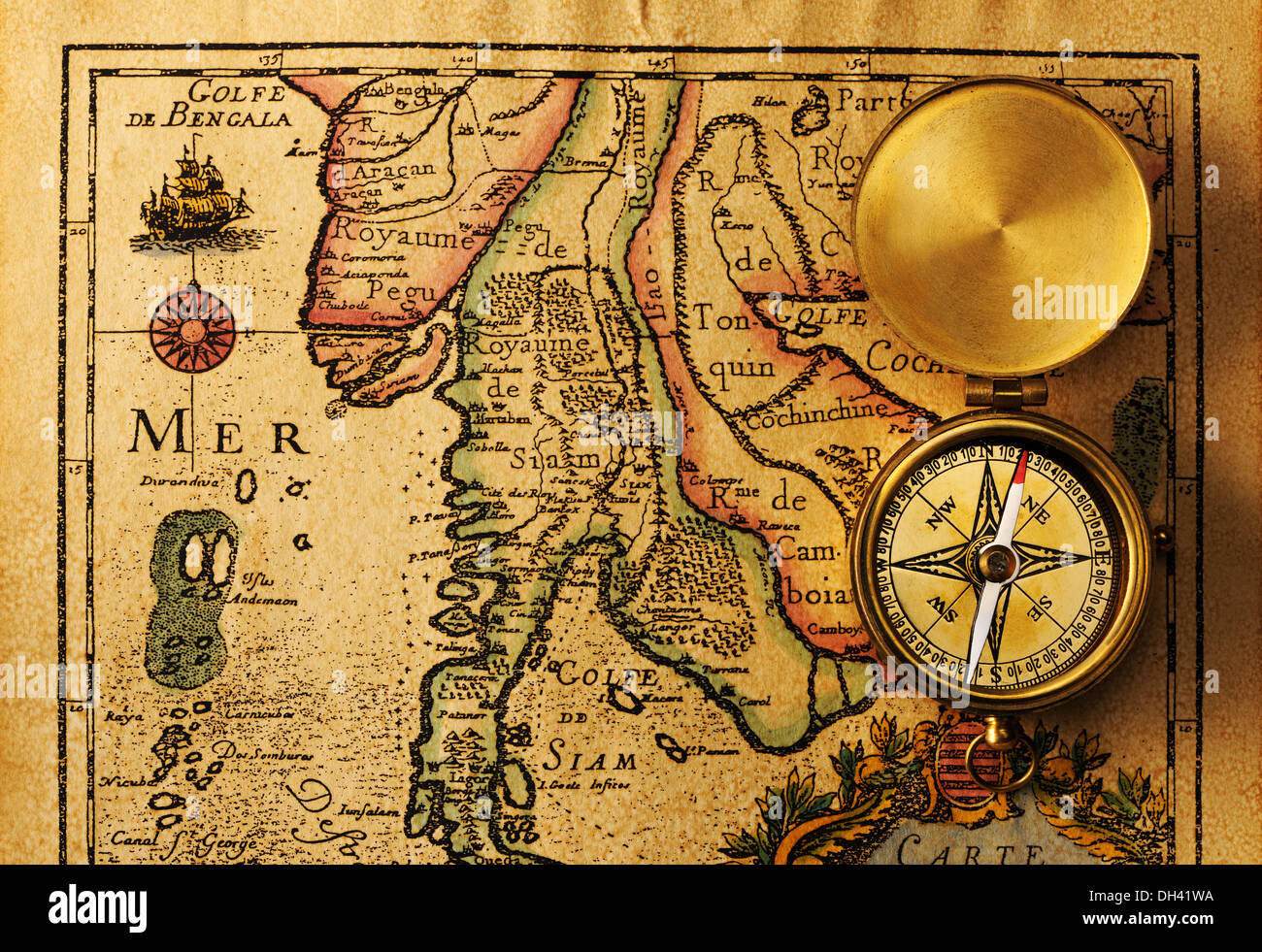 Antique compass over old map Stock Photo - Alamy