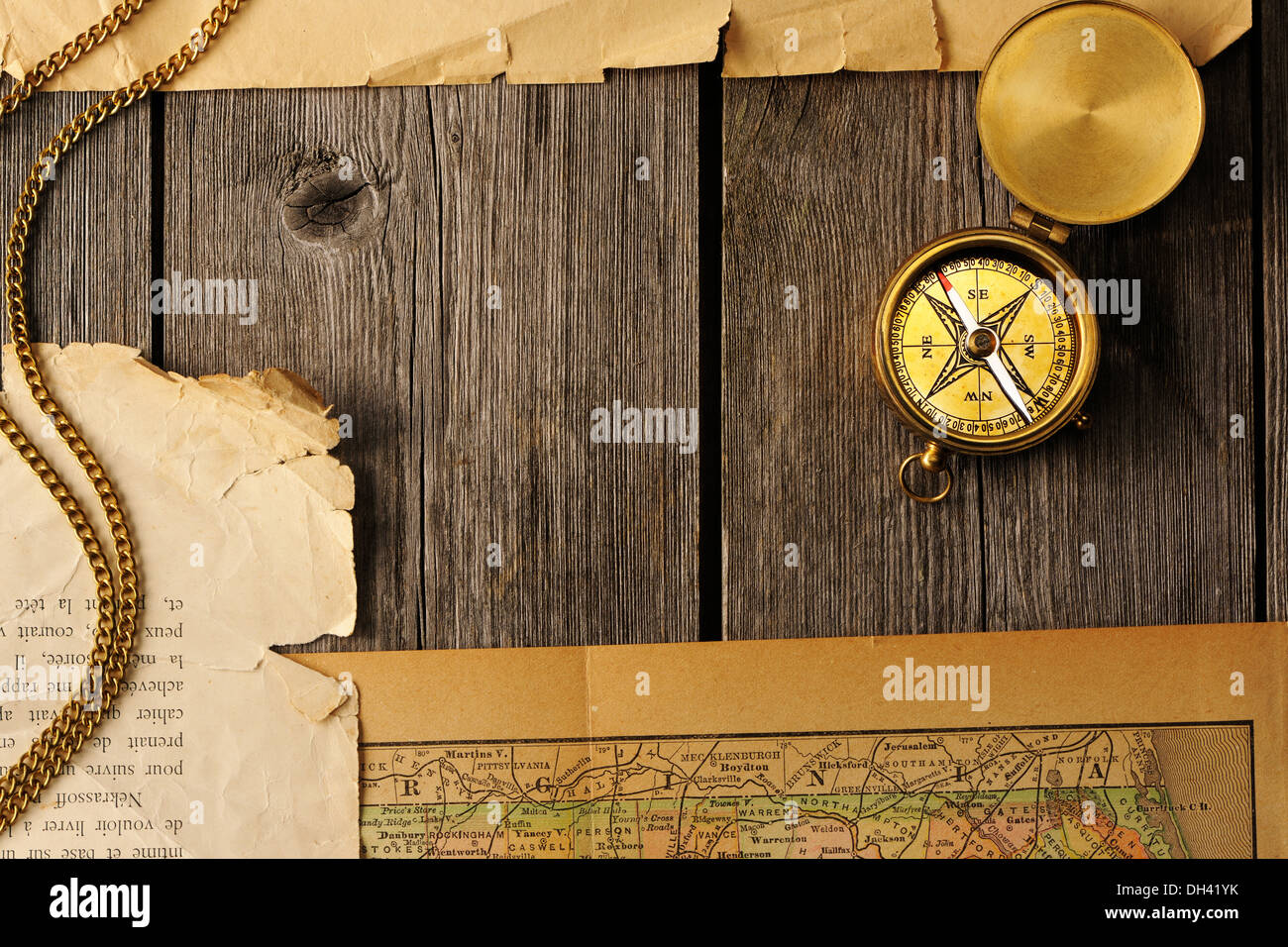 Antique compass over old map Stock Photo - Alamy