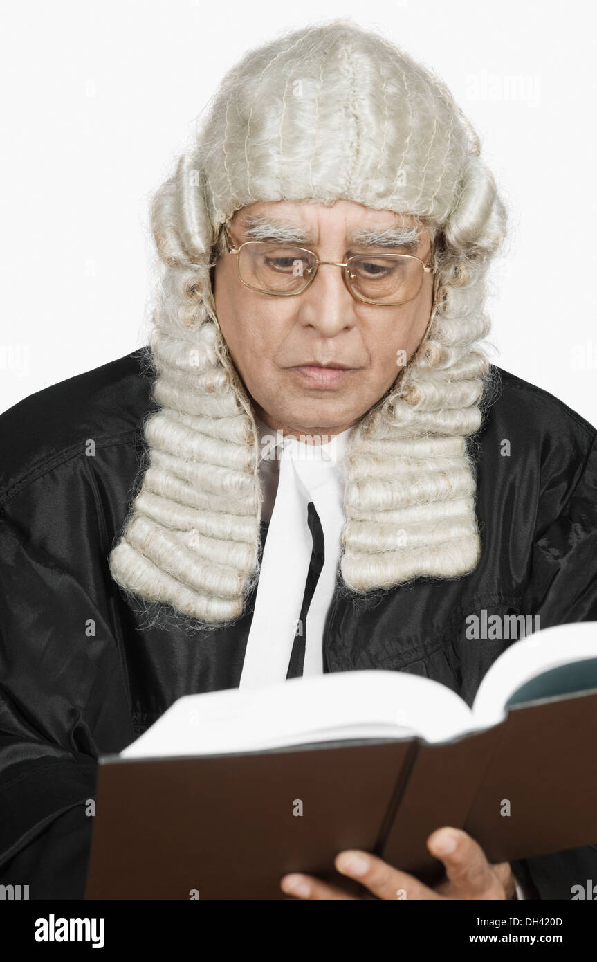 Close-up of a magistrate reading a book Stock Photo - Alamy
