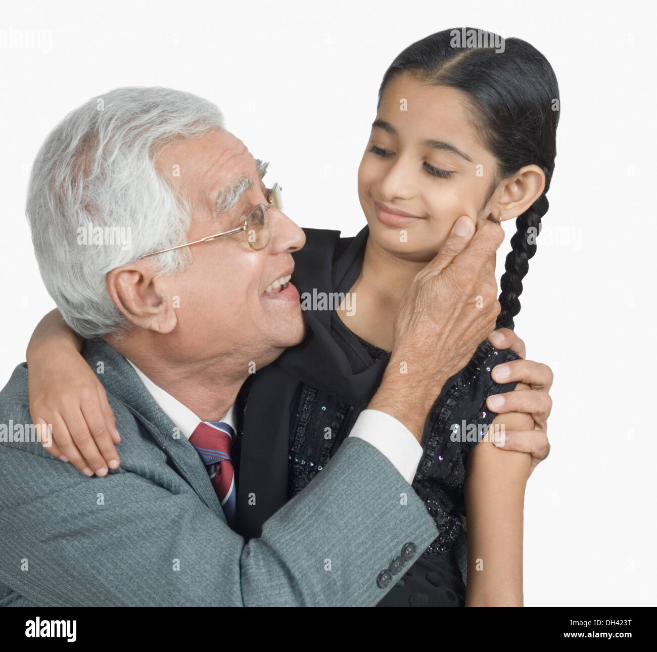 Child hugging her grandad hi-res stock photography and images - Alamy