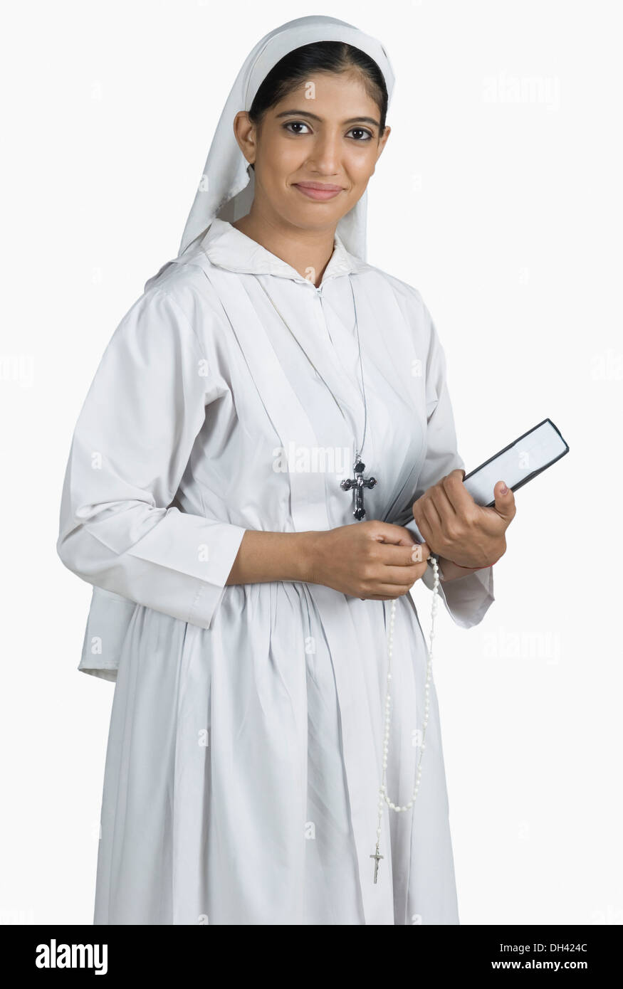 Portrait of a nun holding the Bible Stock Photo - Alamy