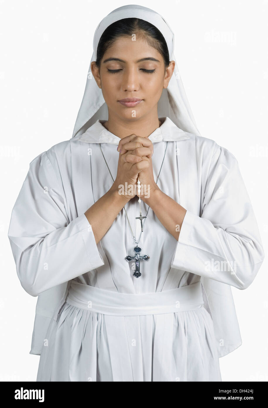 Praying nun holding rosary hi-res stock photography and images - Alamy