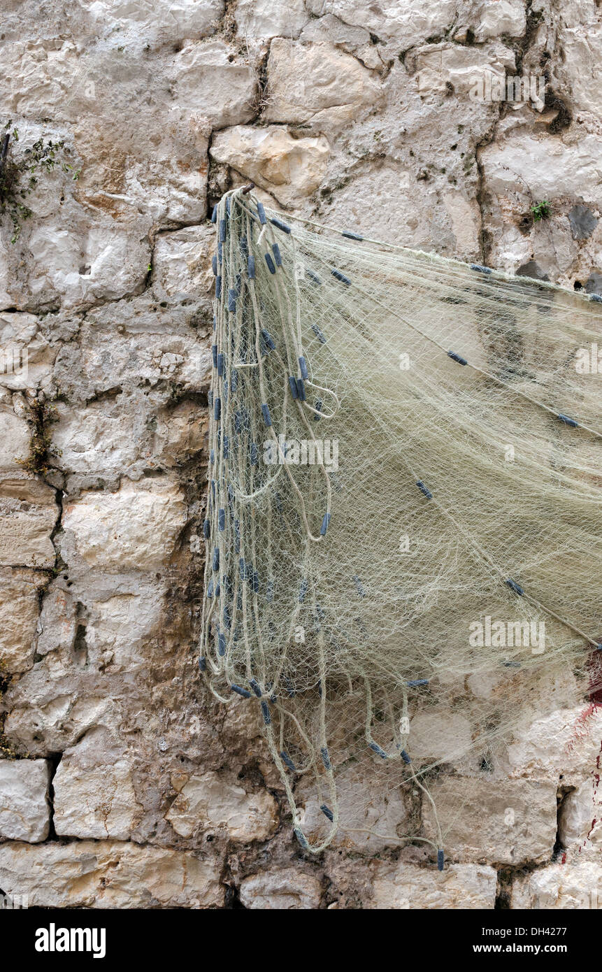 fishing net drying in a Croatian harbor Stock Photo - Alamy