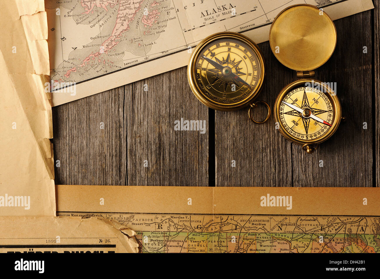 Antique compasses over old map Stock Photo - Alamy