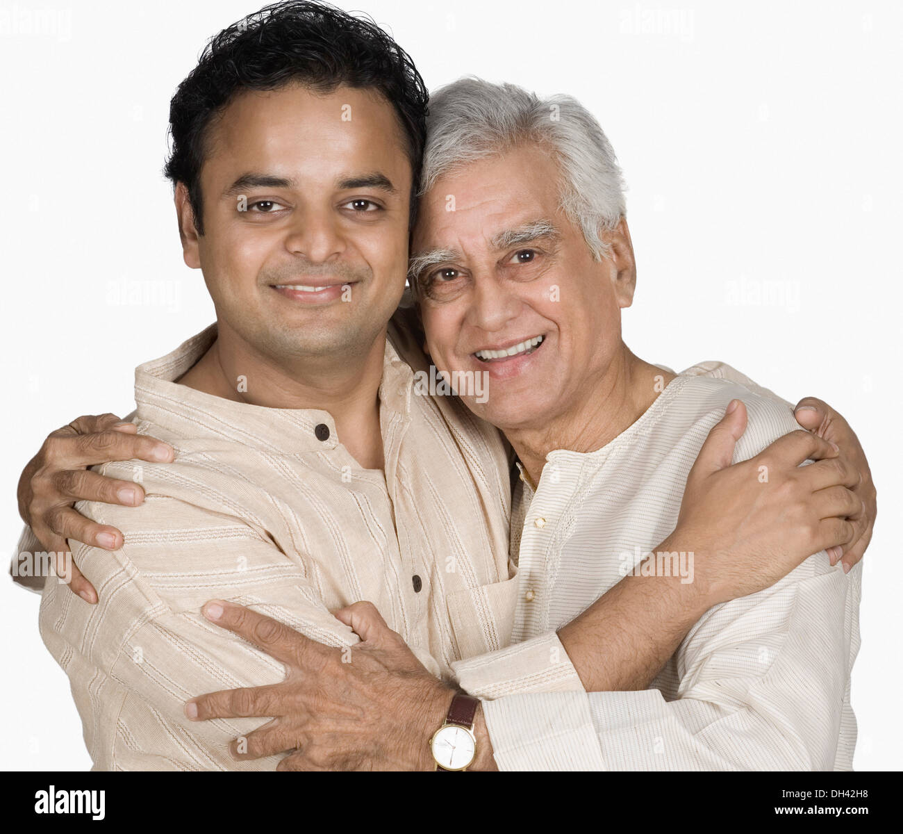 Portrait of a senior man hugging his son Stock Photo - Alamy