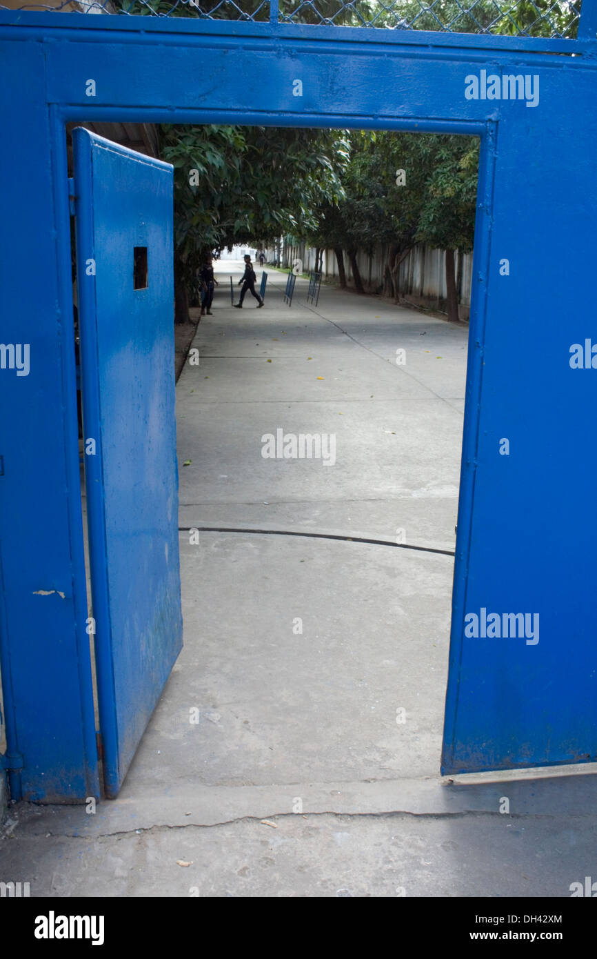 An open door leads to the work area of a garment factory in Phnom Penh ...