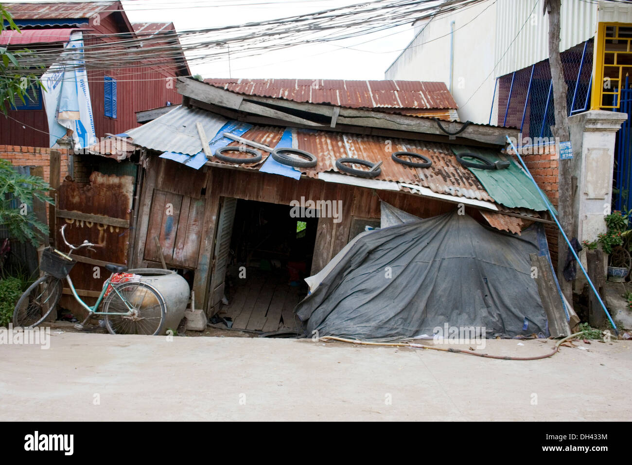 A dilapidated shack inhabited by garment workers is part of the urban ...