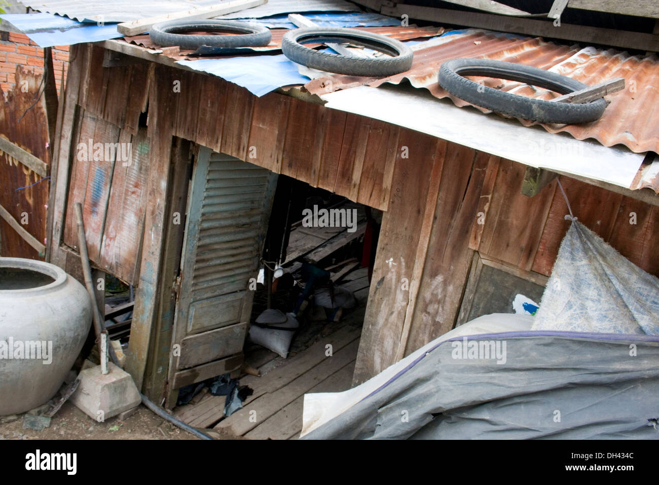 A dilapidated shack inhabited by garment workers is part of the urban ...