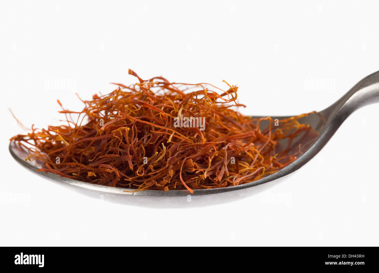 Saffron threads in a spoon Stock Photo - Alamy