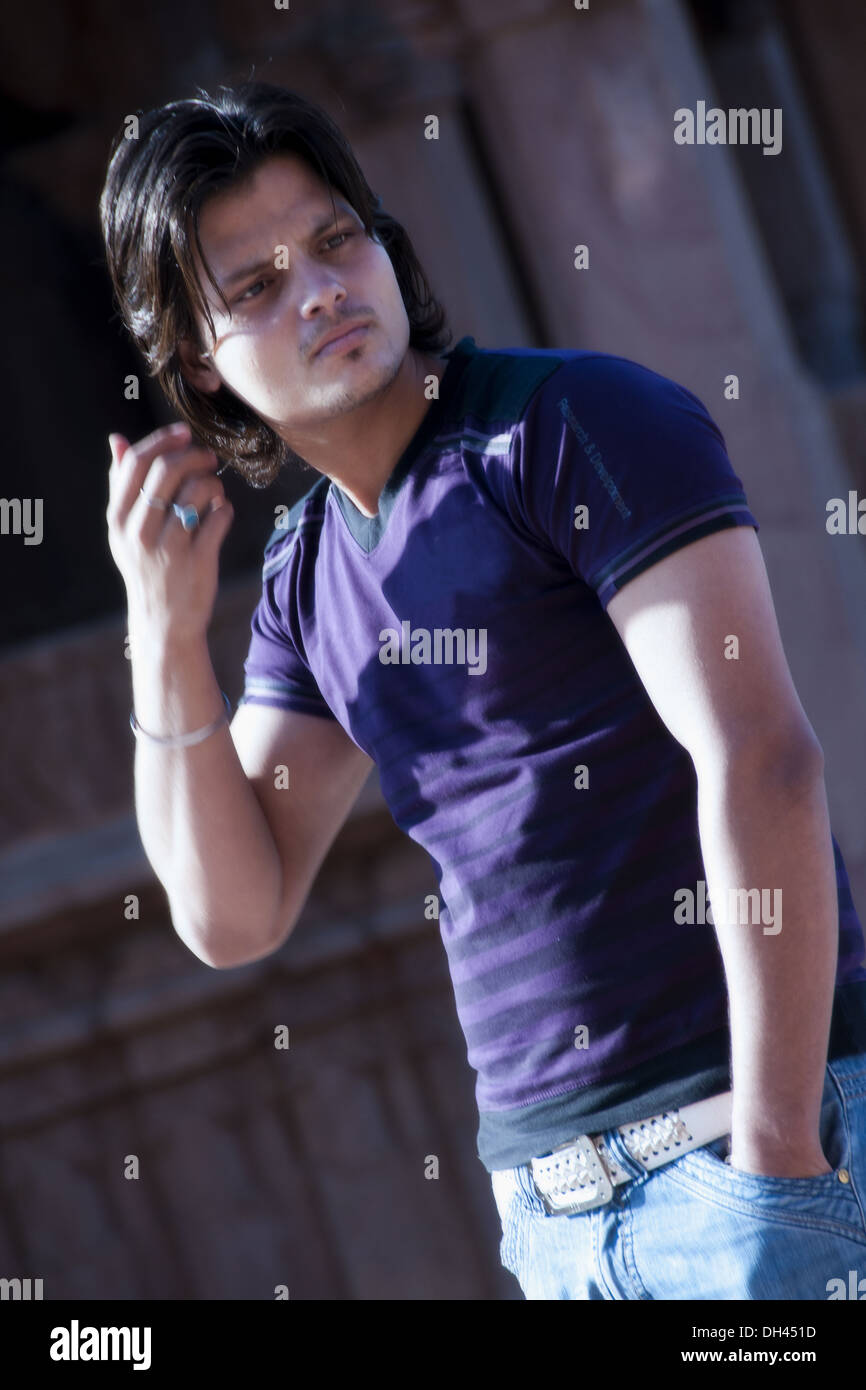 Man in blue jeans and violet purple Tshirt MR#786 Stock Photo - Alamy