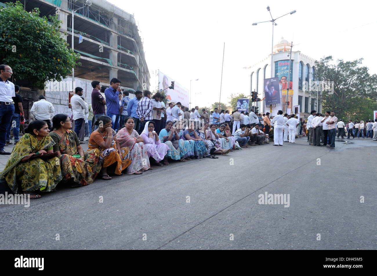 indian women sitting on road dividers waiting for Balasaheb Thackeray ...