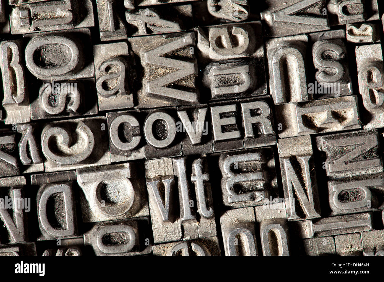 Old lead letters forming the word COVER Stock Photo - Alamy
