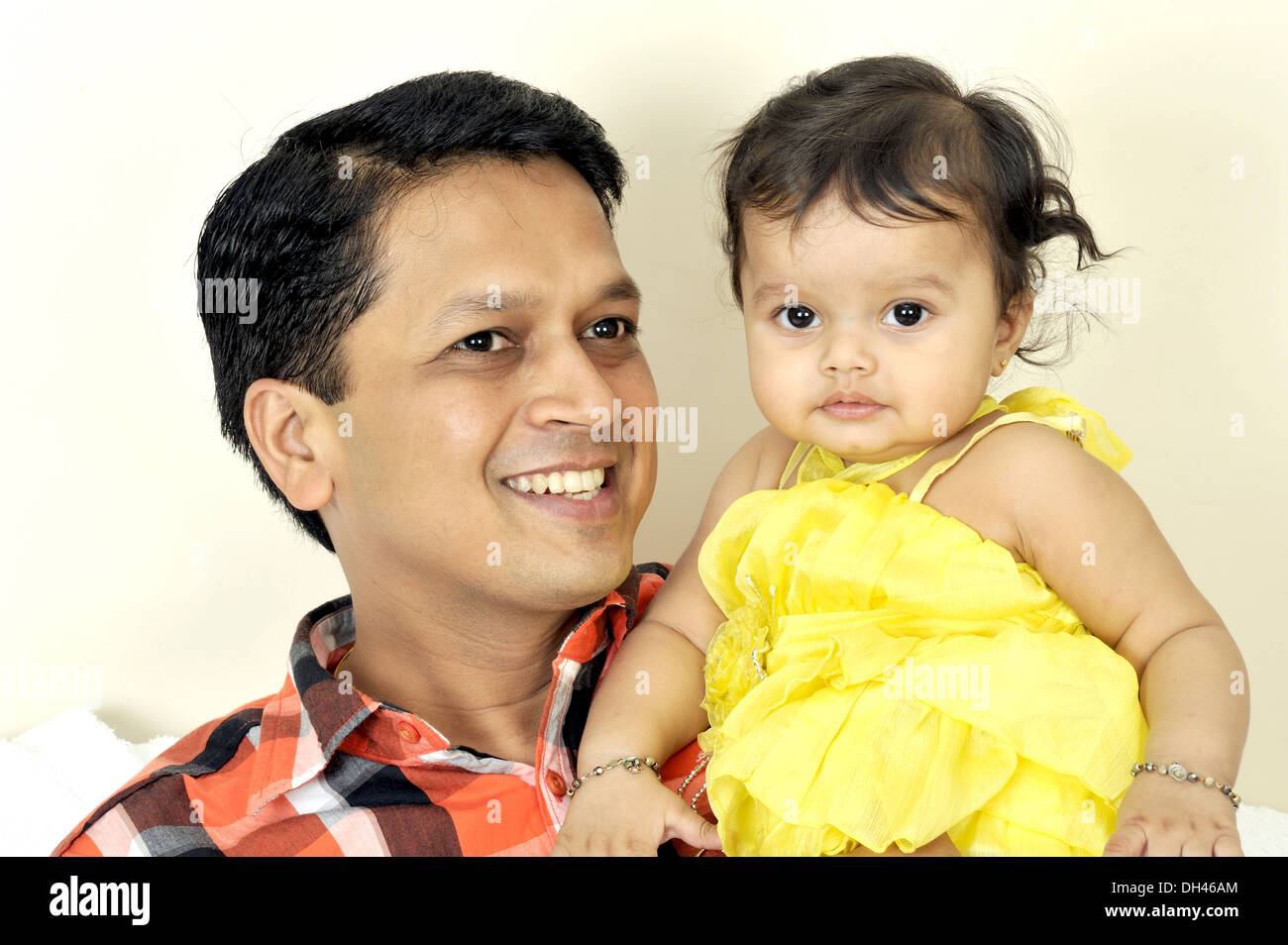 Indian man father smiling holding baby girl daughter India MR#736O&PA ...