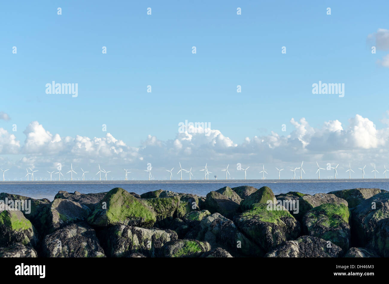 Offshore wind farm and rocks Stock Photo - Alamy