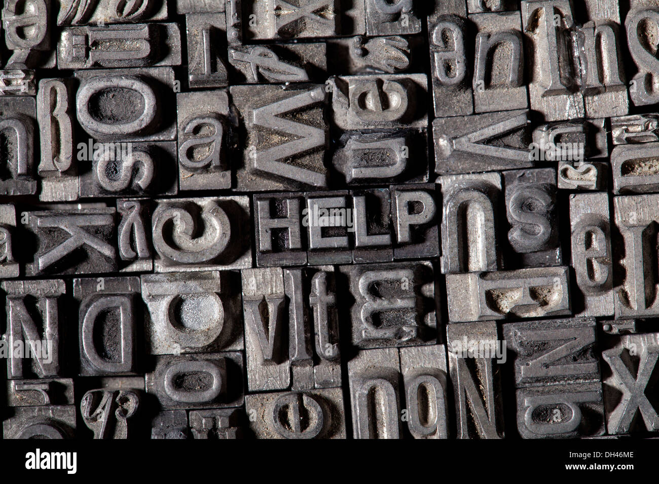 Old lead letters forming the word HELP Stock Photo - Alamy