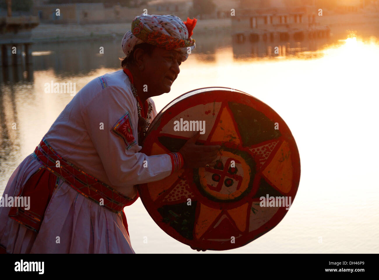 Man Playing Musical instrument dafli Gadisar lake Rajasthan India Asia ...