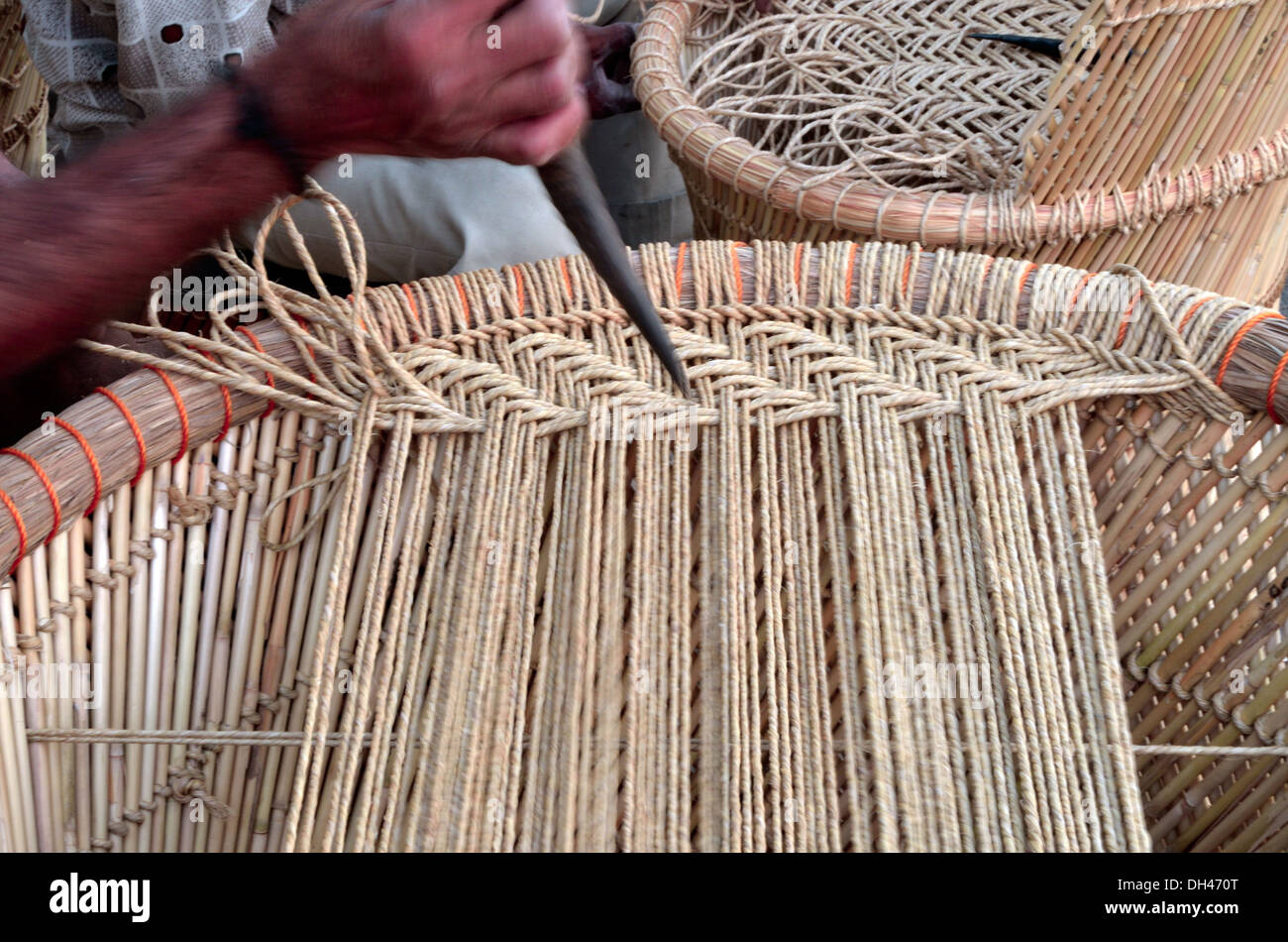 Man weaving plastic stool mudha for sitting Ajmer Rajasthan India Asia ...