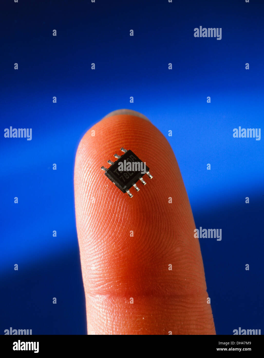 Microchip on a finger Stock Photo - Alamy