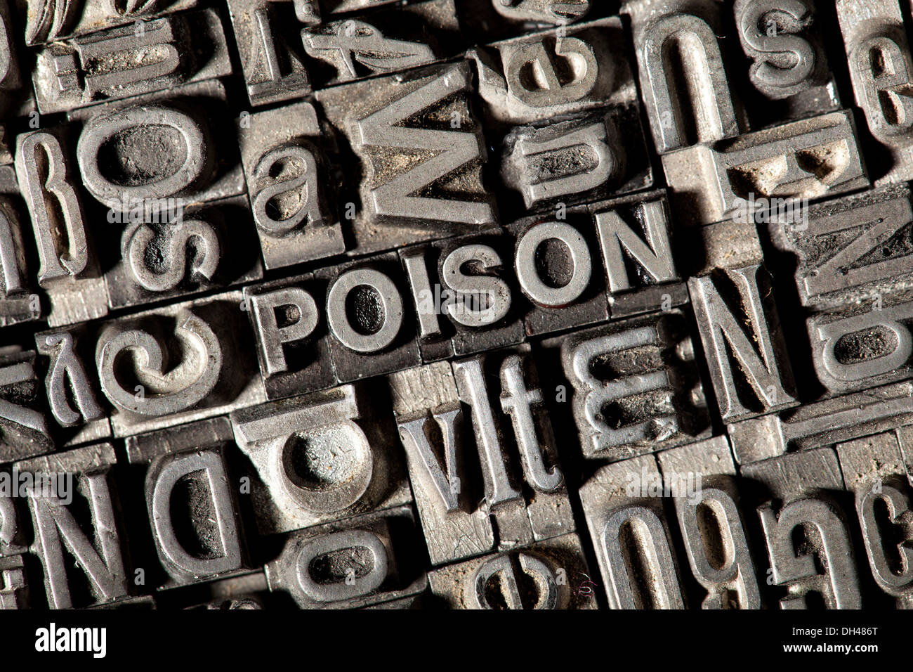 Old lead letters forming the word "POISON Stock Photo - Alamy