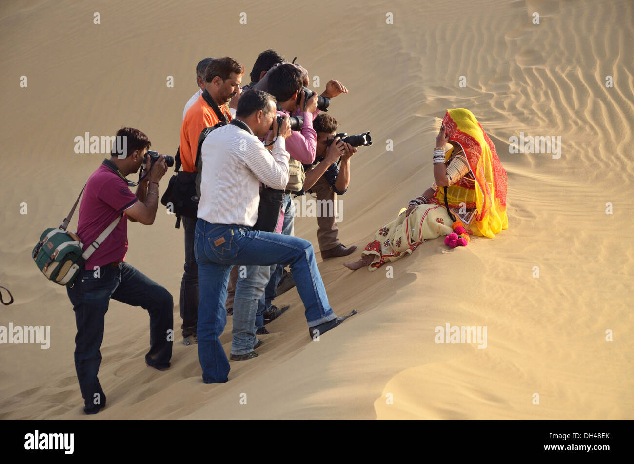 Photographers taking the photographs of model in desert Rajasthan India ...