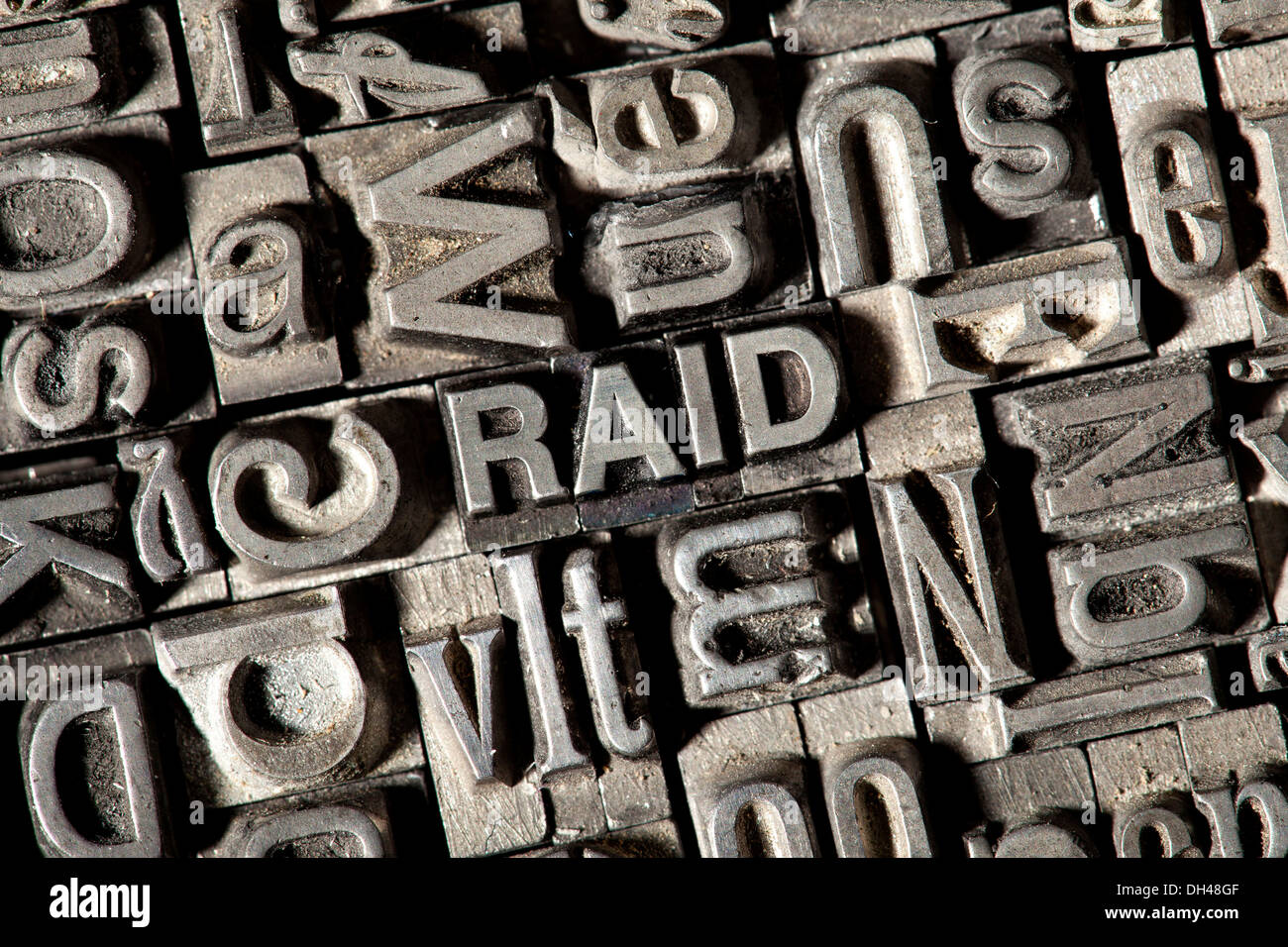 Old lead letters forming the word "RAID Stock Photo - Alamy